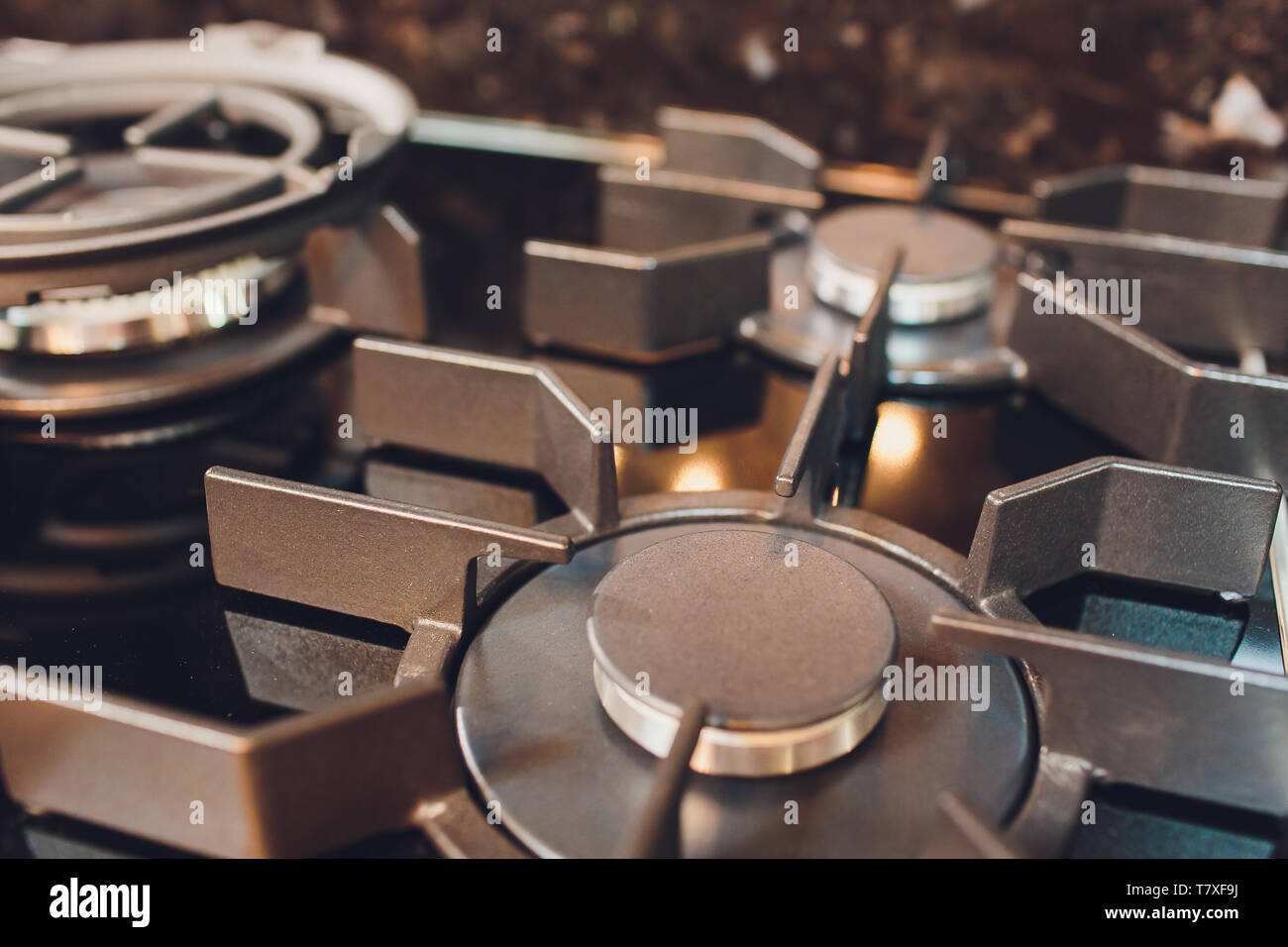 Cooking on a modern design gas stove burner - kitchen tools details ...