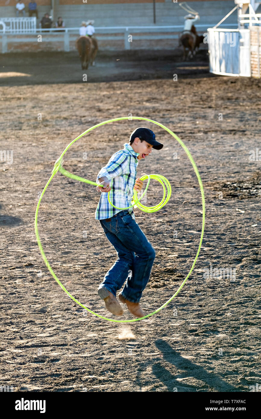 A young Charro practices roping tricks during a family charro practice ...