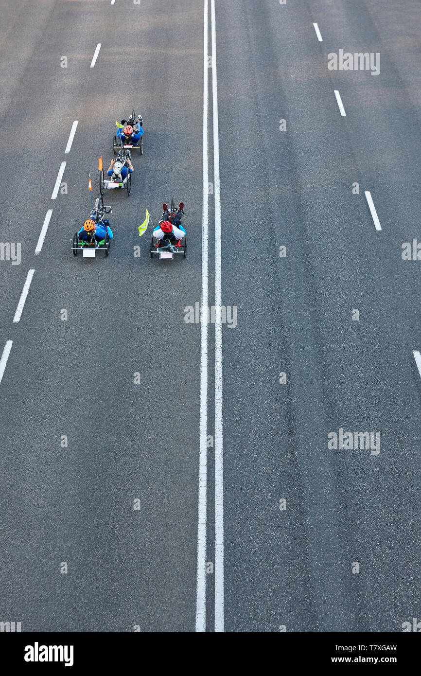 Disabled bike riders on the street. Urban mobility. Sport activity ...