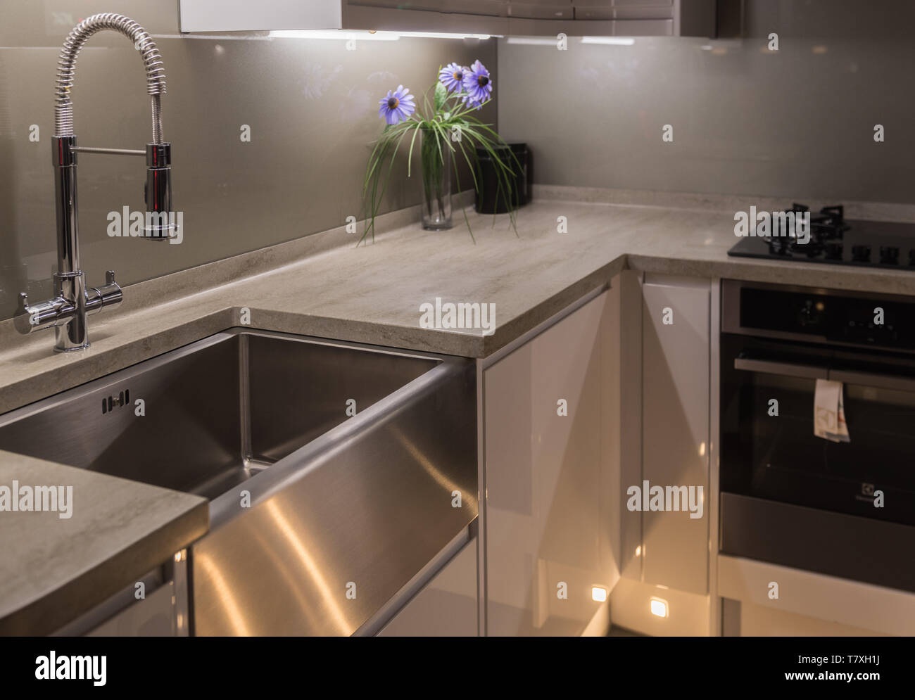 Modern Kitchen Counter Top with Violet Flowers Stock Photo - Alamy