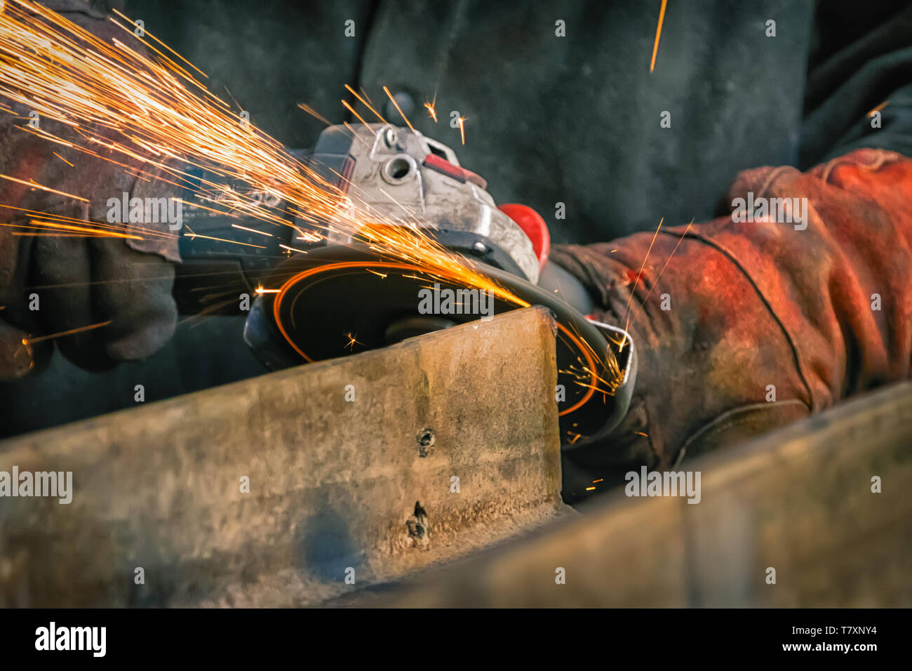 African man grinding cutting hi-res stock photography and images - Alamy