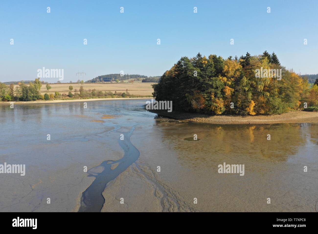 Aerial photo of dry drained breeding pond with mud. Carps, perch, roach ...