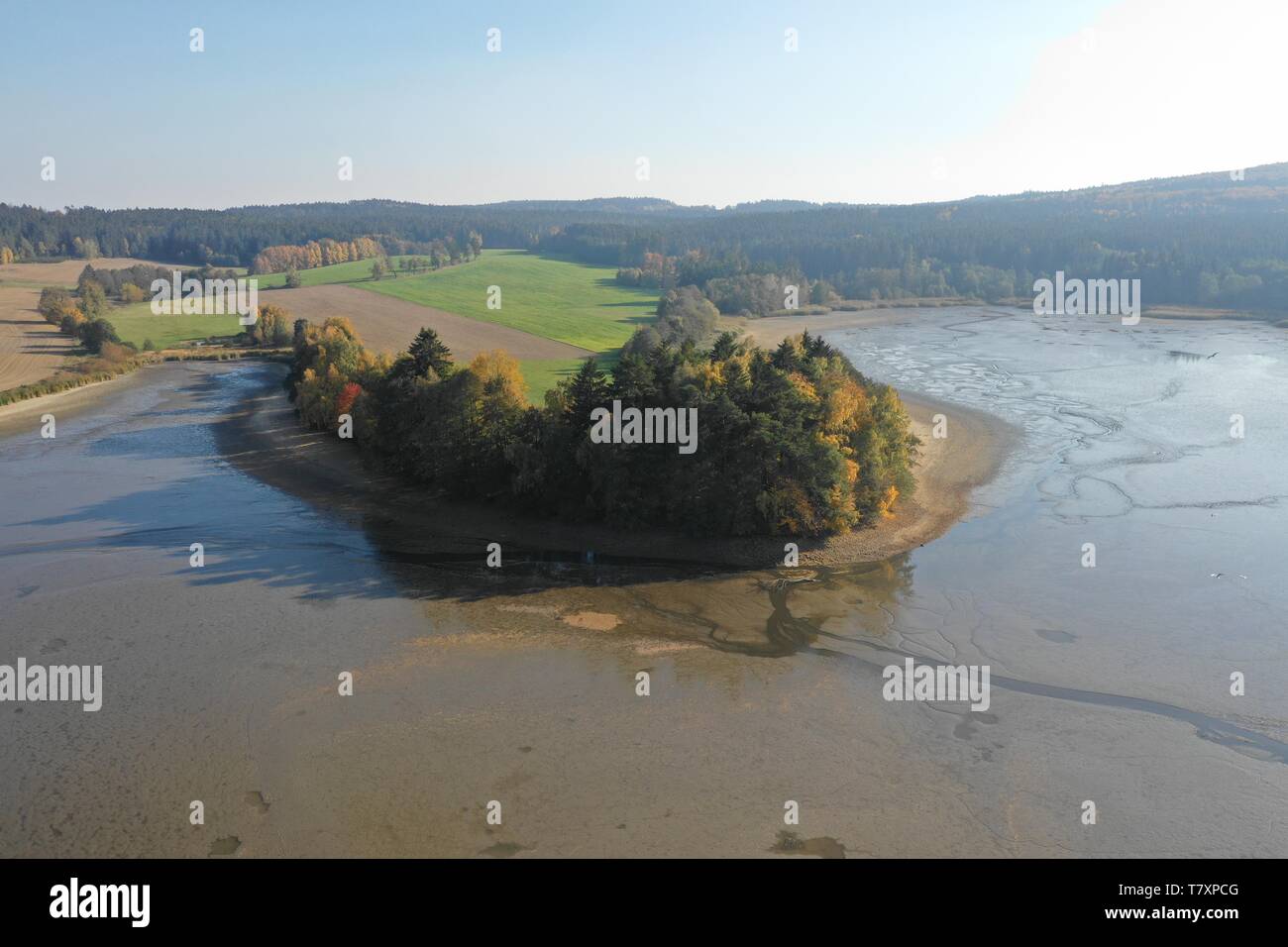 Aerial photo of dry drained breeding pond with mud. Carps, perch, roach ...
