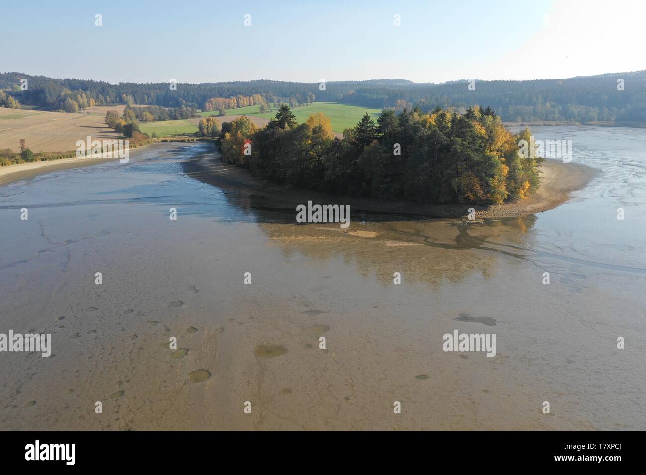 Aerial photo of dry drained breeding pond with mud. Carps, perch, roach ...
