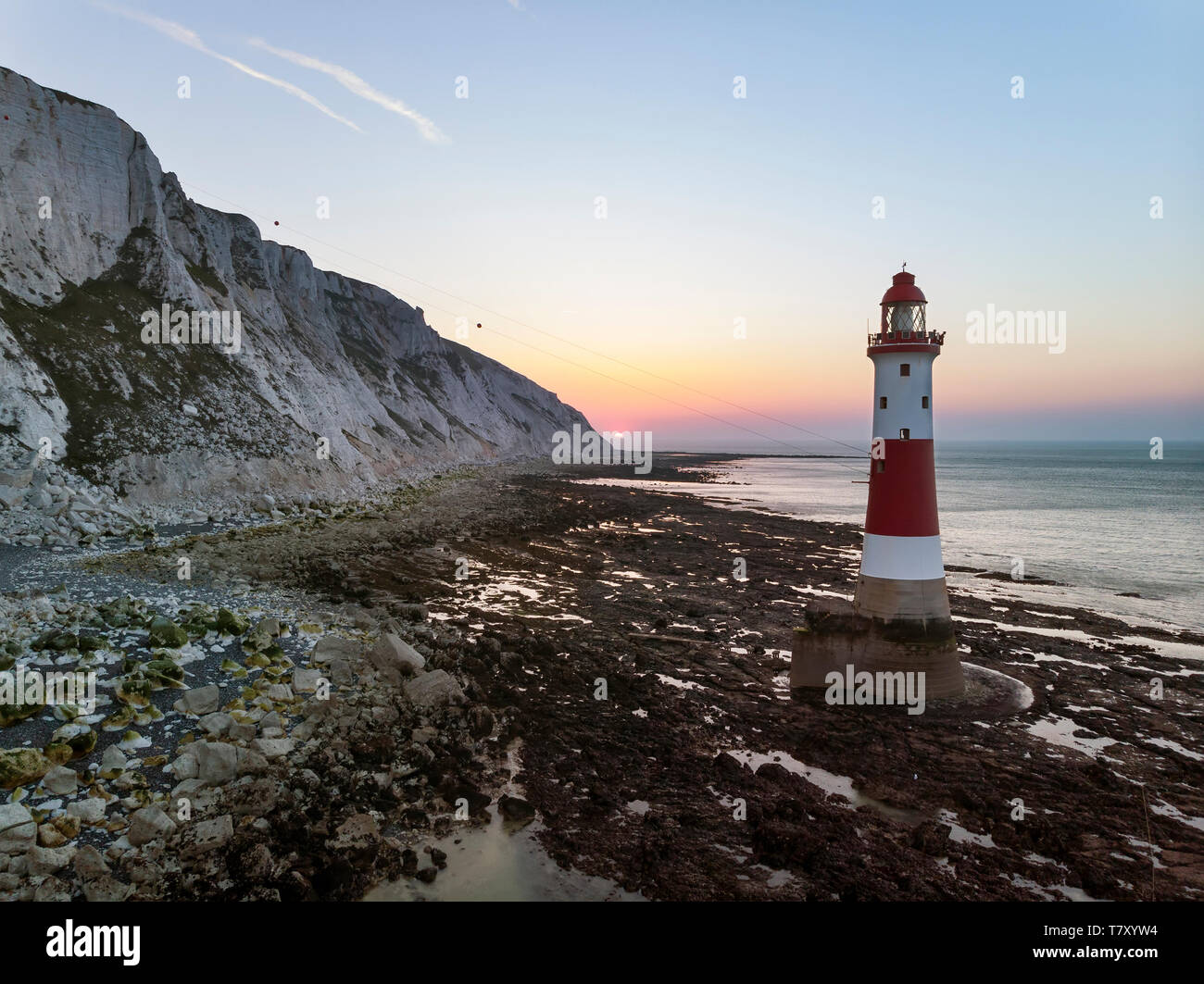 Aerial drone landscape image of lighthouse and chalk cliffs at sunrise ...