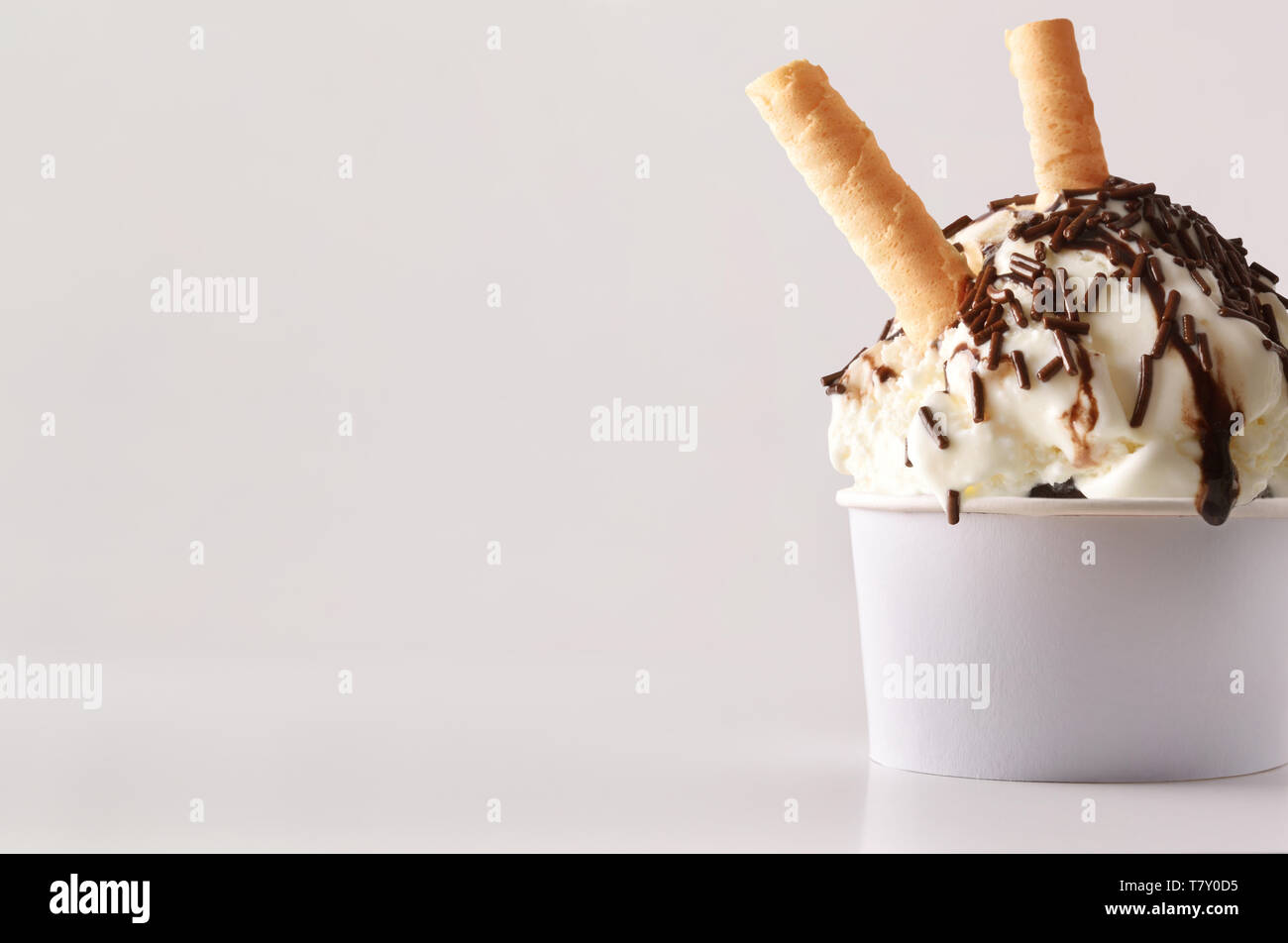 Ice cream cup on table isolated close up. Horizontal composition. Front ...