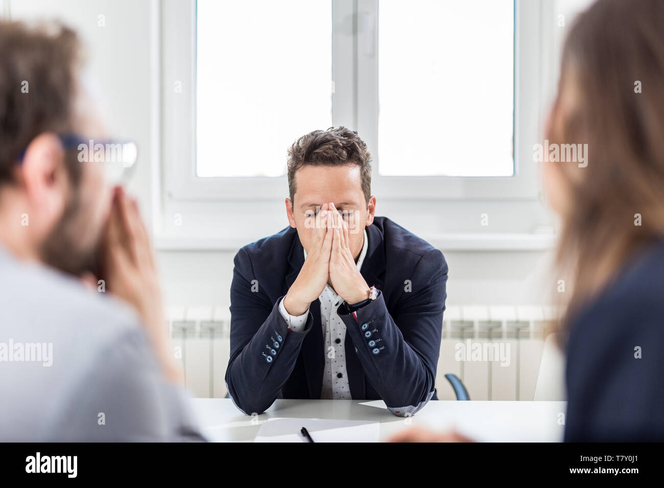 Unhappy person in team meeting hi-res stock photography and images - Alamy
