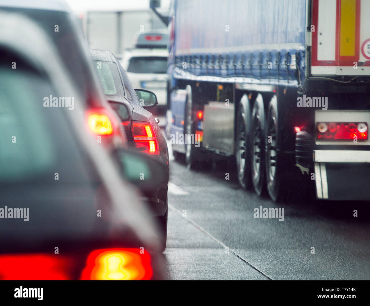 Cars and trucks in traffic jam on highway Stock Photo - Alamy