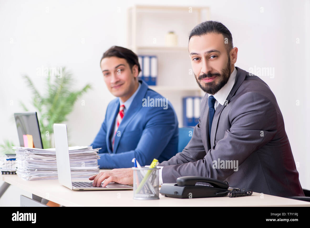 Two male colleagues in the office Stock Photo - Alamy