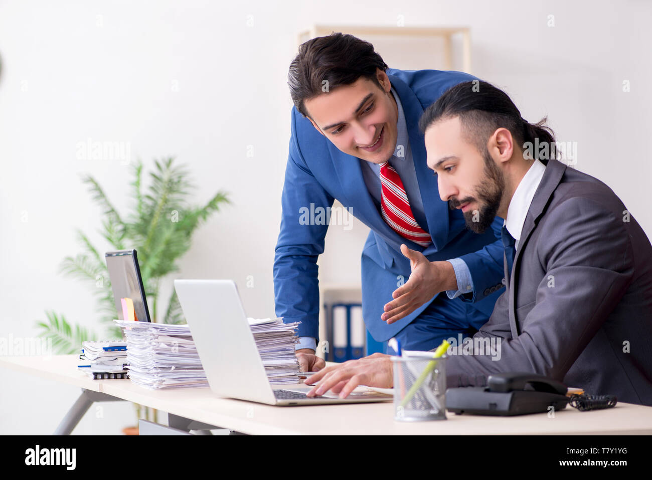 Two male colleagues in the office Stock Photo - Alamy