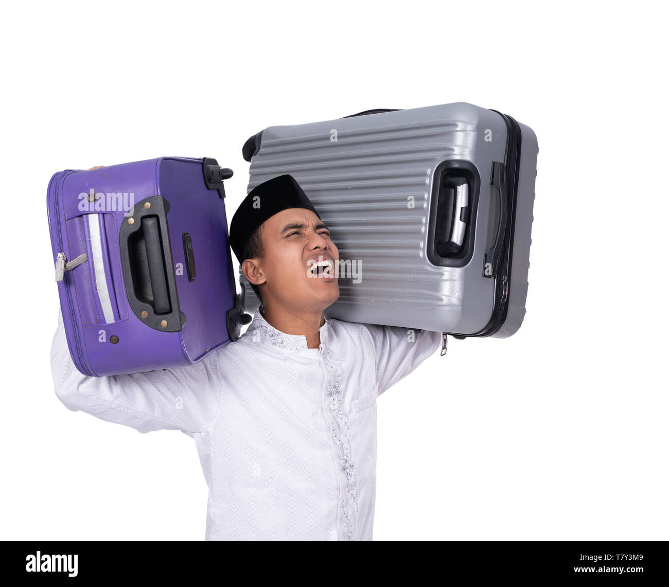 tired muslim man carrying two heavy suitcase on his shoulder Stock ...