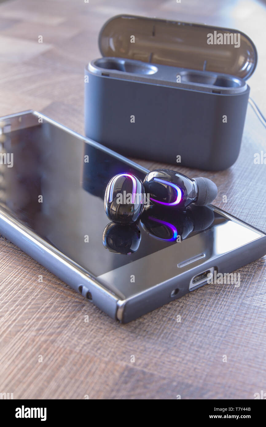 Smartphone Earphones with Bluetooth connection in black color Stock ...