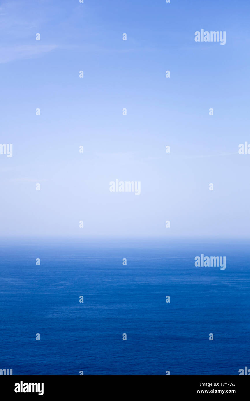 Horizontal line of calm blue sea on the day light Stock Photo - Alamy