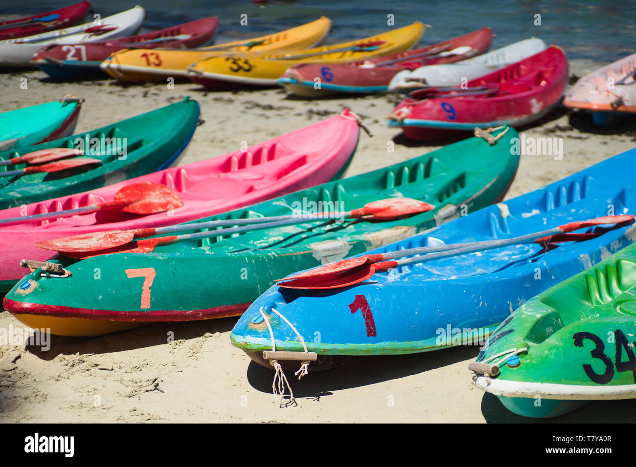 Many colorful old Canoes Kayaks on the beach at Nang Rum Beach ...