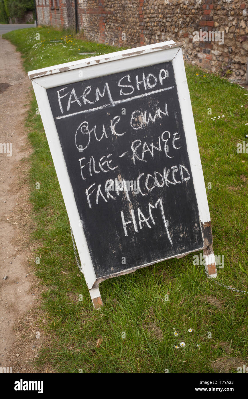 Hand-written sign for Farm Shop selling free-range farm-cooked ham in ...