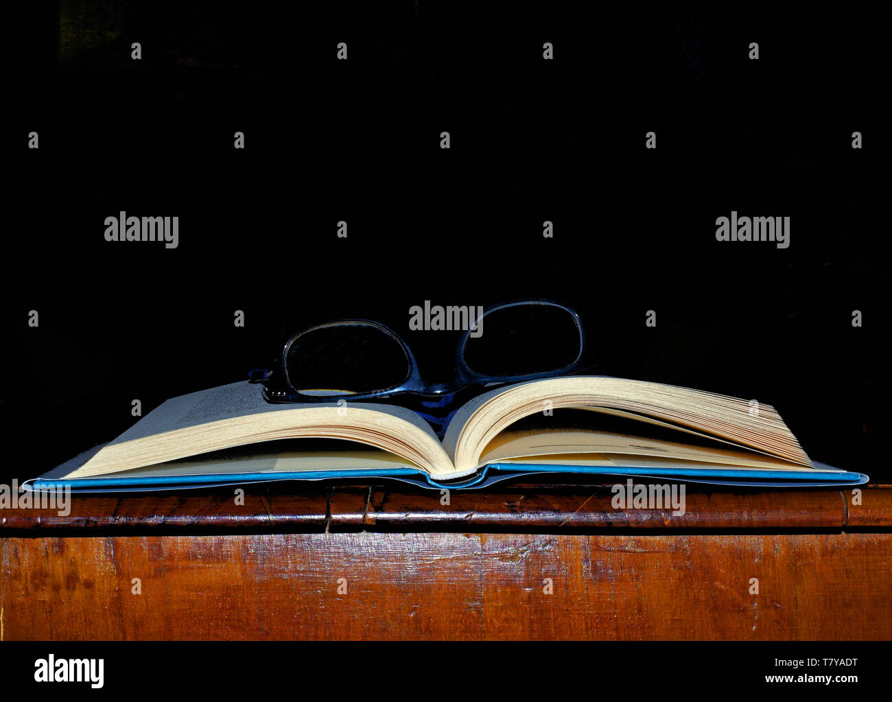 Open book close-up with eye-glasses Stock Photo - Alamy