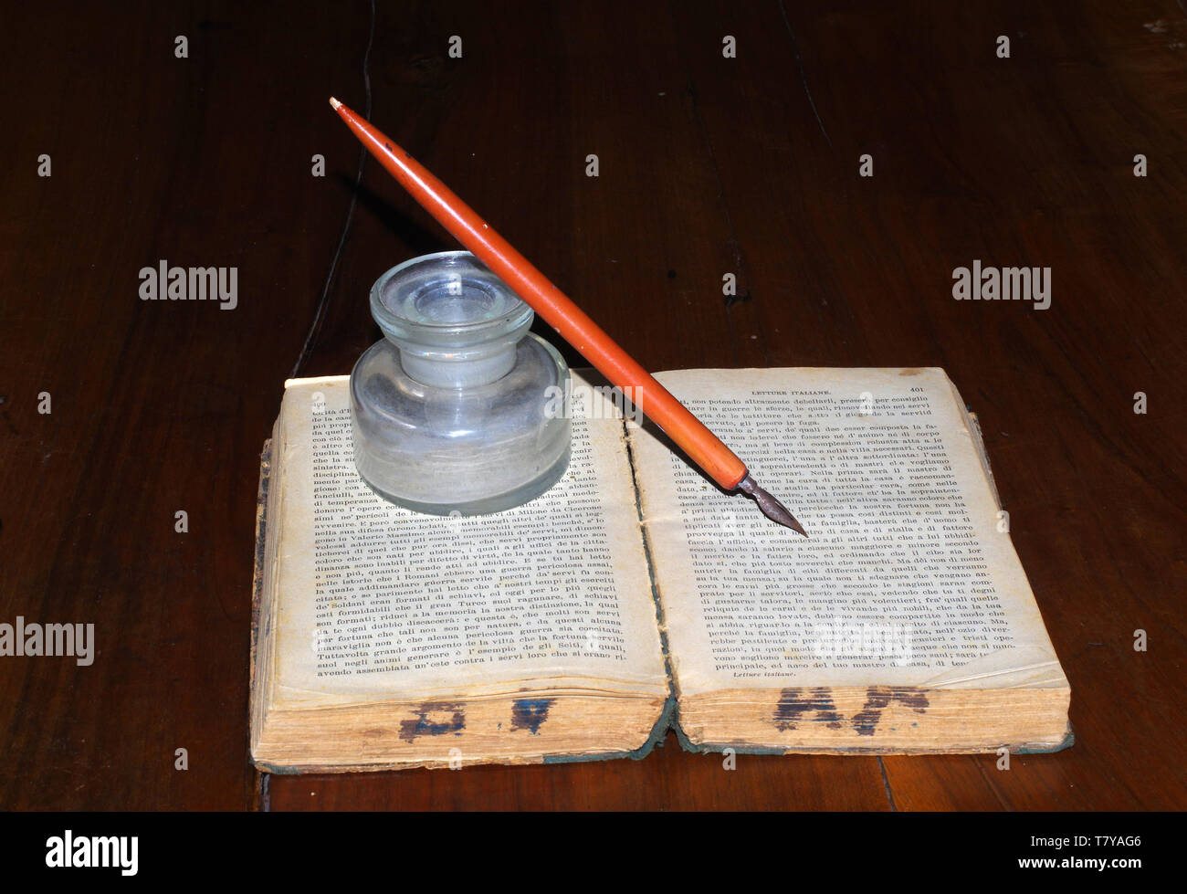 Old book on the table with pen and inkpot Stock Photo - Alamy
