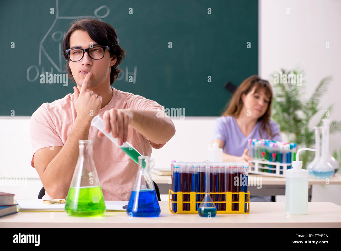 Two chemists students in classroom Stock Photo - Alamy