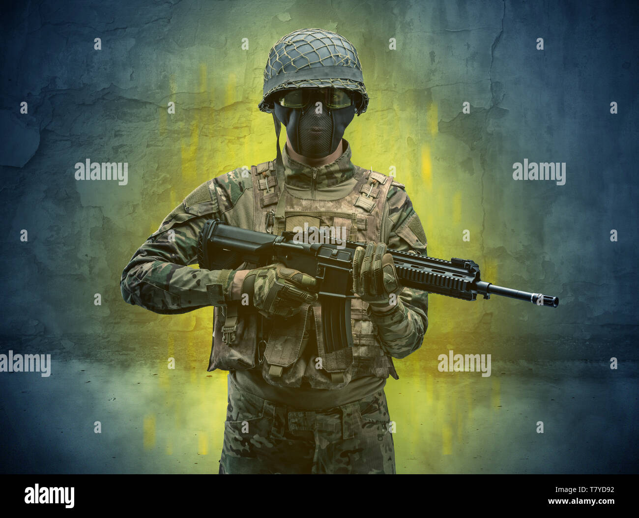 Hazard, menace soldier in a ruined crumbly building with arms on his ...