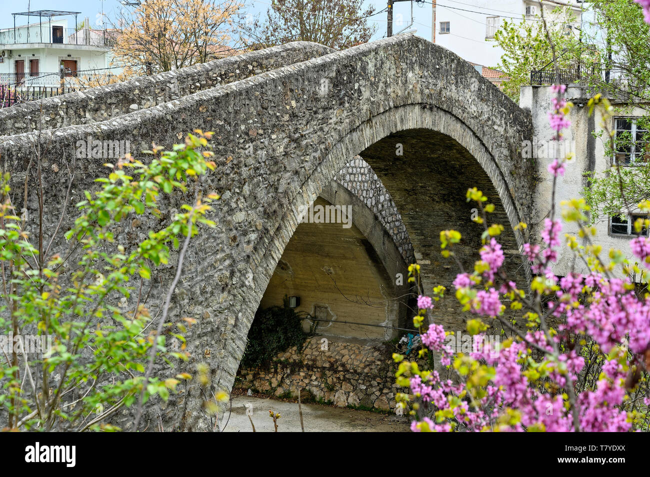 View of the traditional stone bridge in the city of Elassona in ...