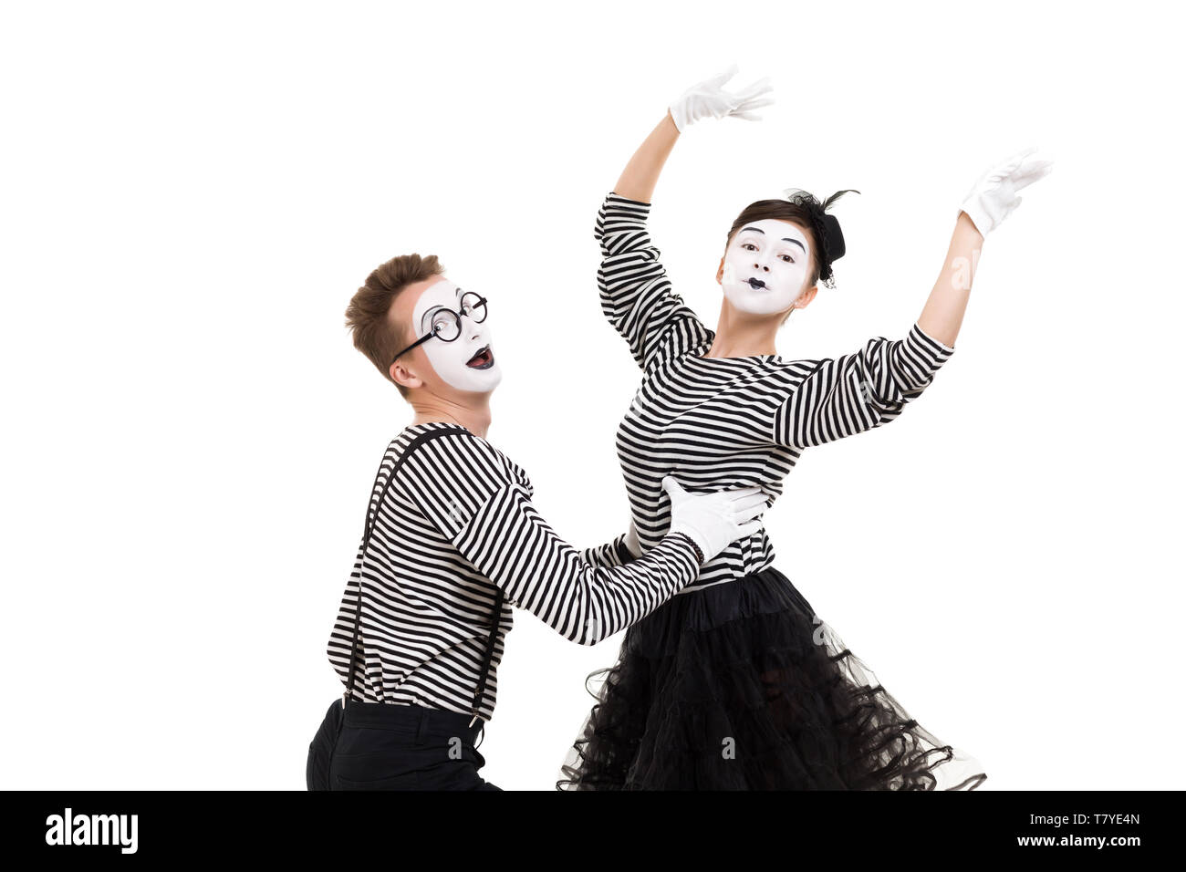 Smiling mimes in striped shirts. Man and woman dressed as actors of ...