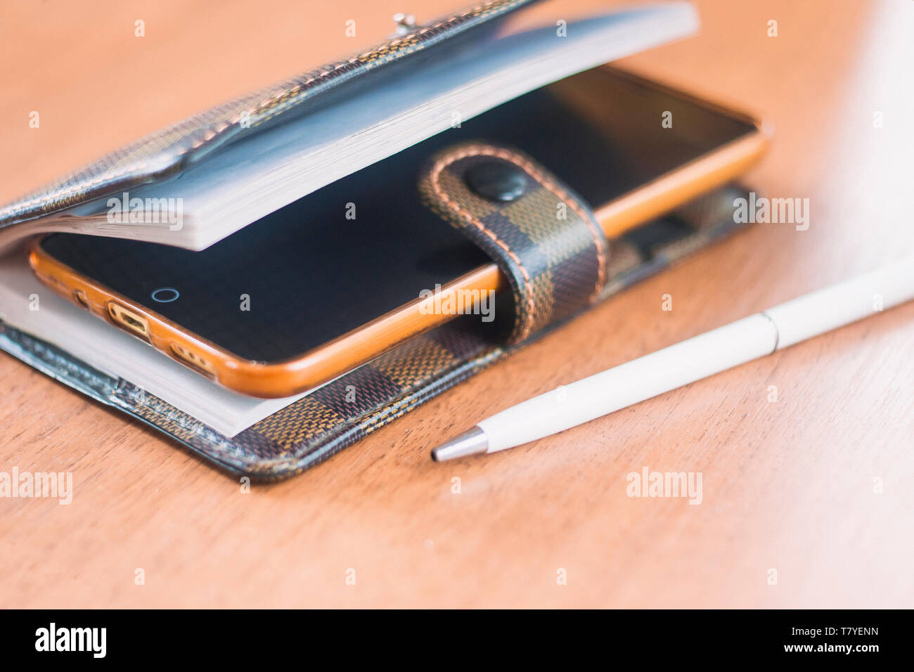 Pen and mobile phone on office table above view hi-res stock ...