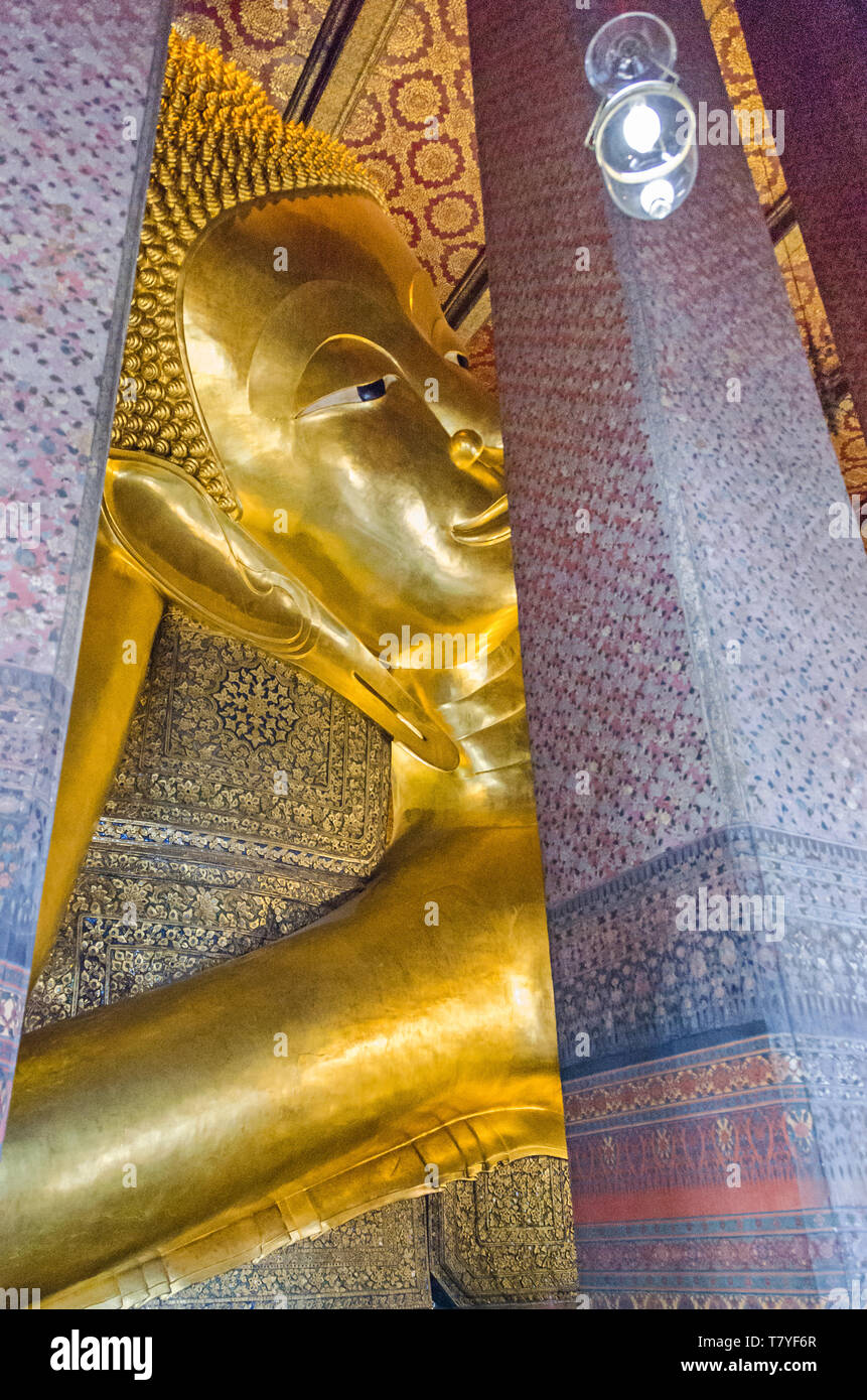 Right arm supporting the head with tight curls of the Reclining Buddha ...