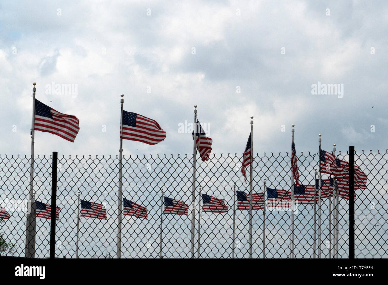 Flag behind metal fence hi-res stock photography and images - Alamy
