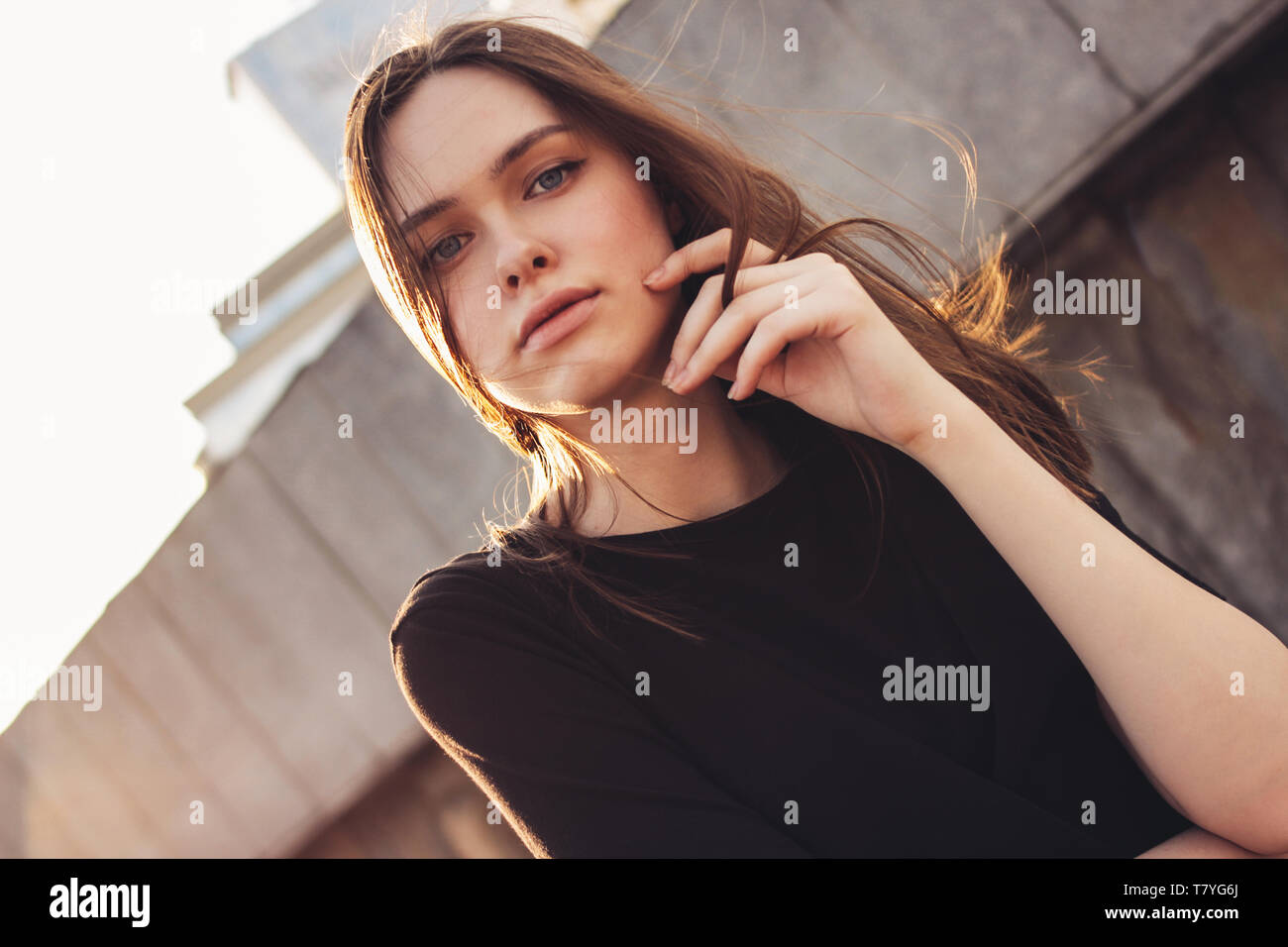 Young beautiful long wind hair girl fashion model on city street Stock ...