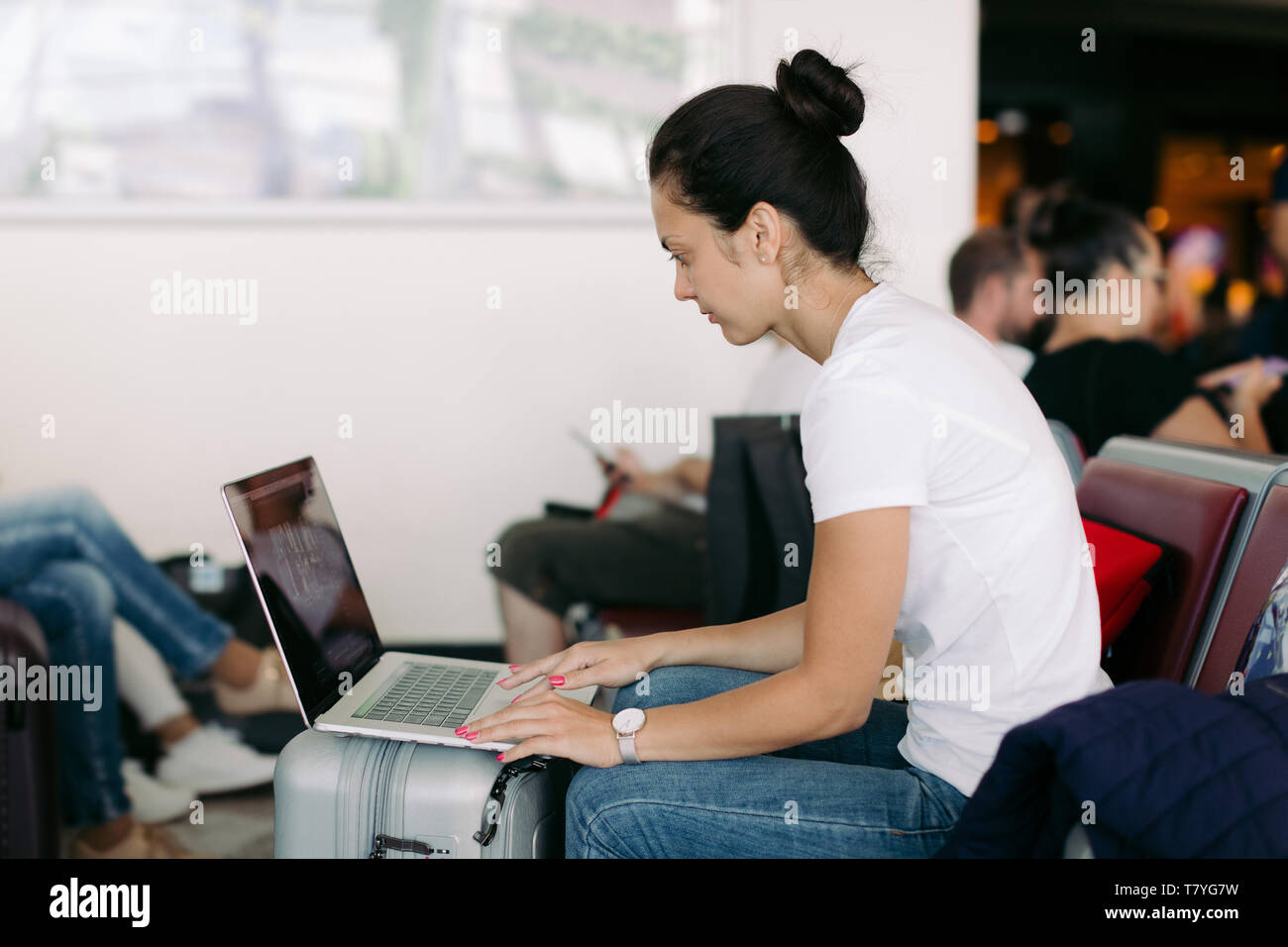 Smiling girl airport check in hi-res stock photography and images - Alamy