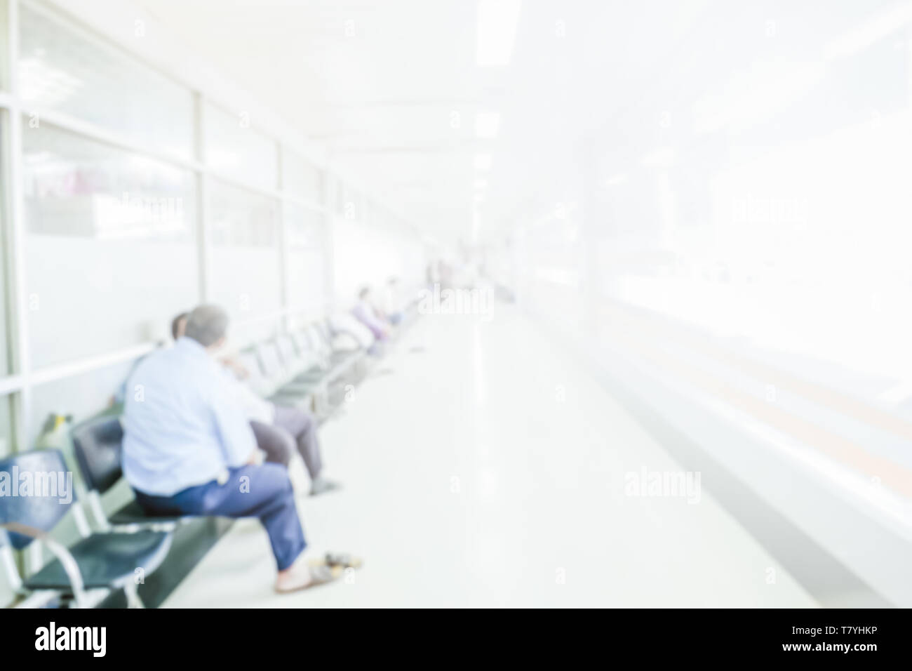 Abstract blurred people waiting in corridor hospital interior ...