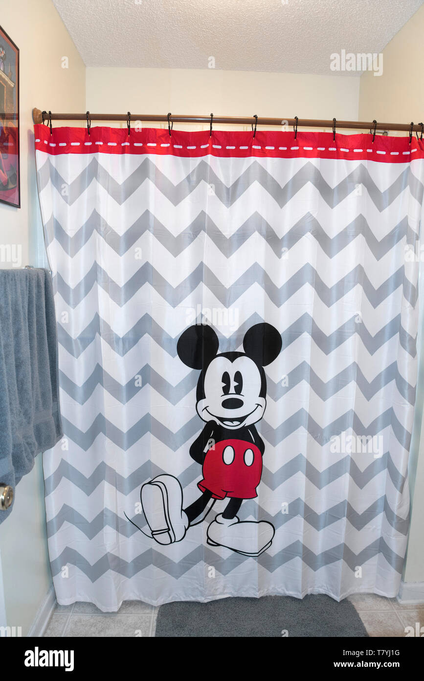 Mickey Mouse and other Disney characters decorating a bathroom Stock ...