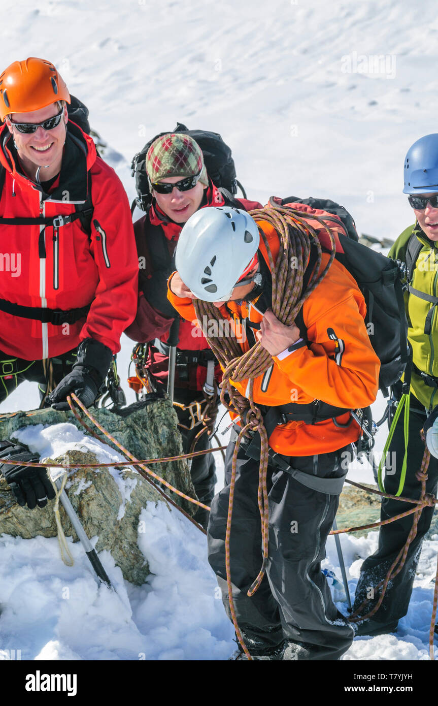 Alpinists preparing for a high alpine expedition with a professional ...