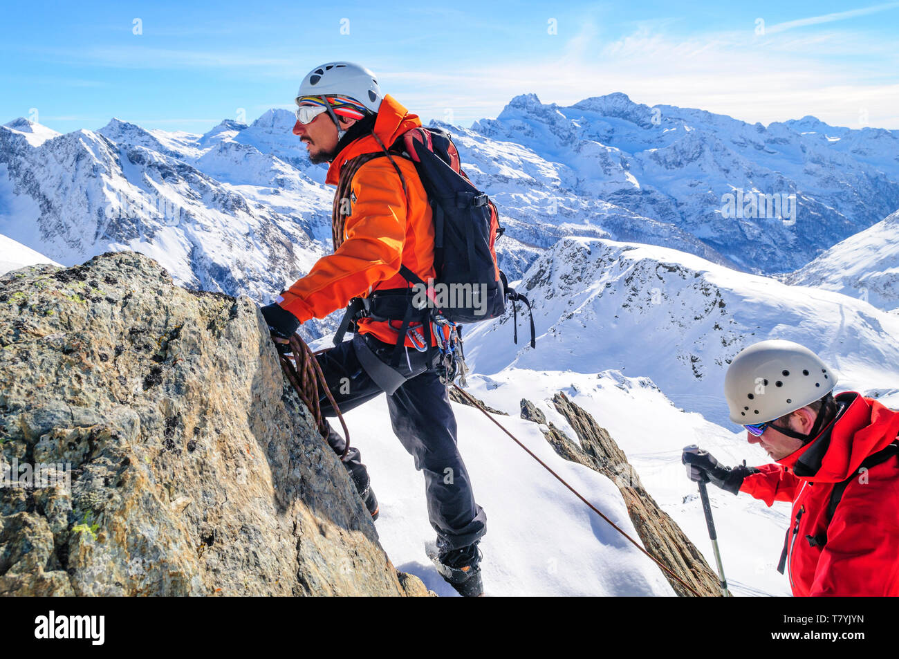 Mountain guide leading a group of alpinists up to Monte Rosa Glaciers ...