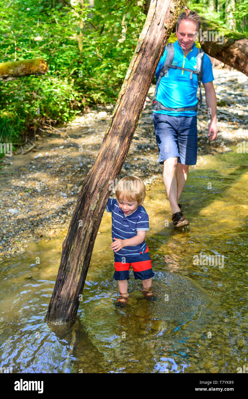 Father walking in river hi-res stock photography and images - Alamy