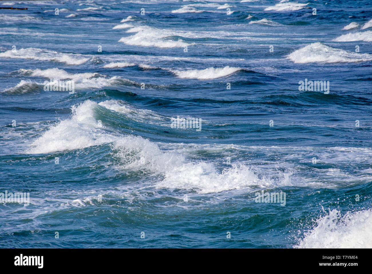 Waves breaking on a beach Stock Photo - Alamy