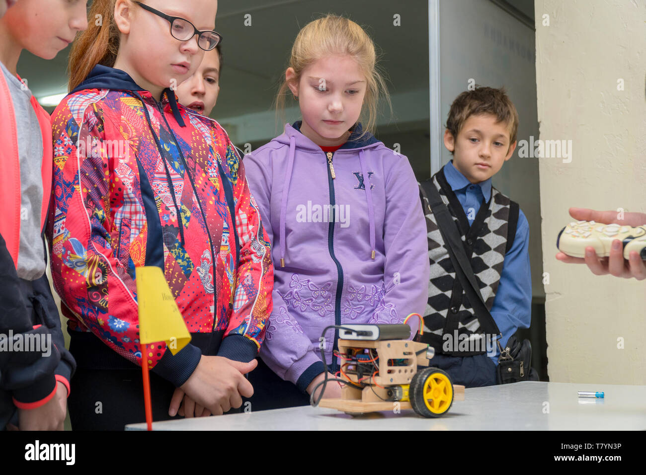 Primary school students looking at a homemade car model Stock Photo - Alamy