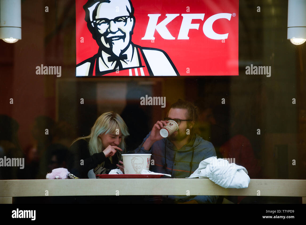 A couple seen at KFC in the city centre Stock Photo - Alamy