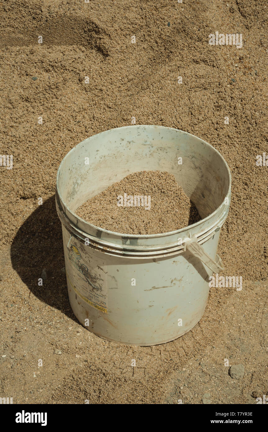 Plastic bucket with sand in a construction site at Castelo de Vide ...