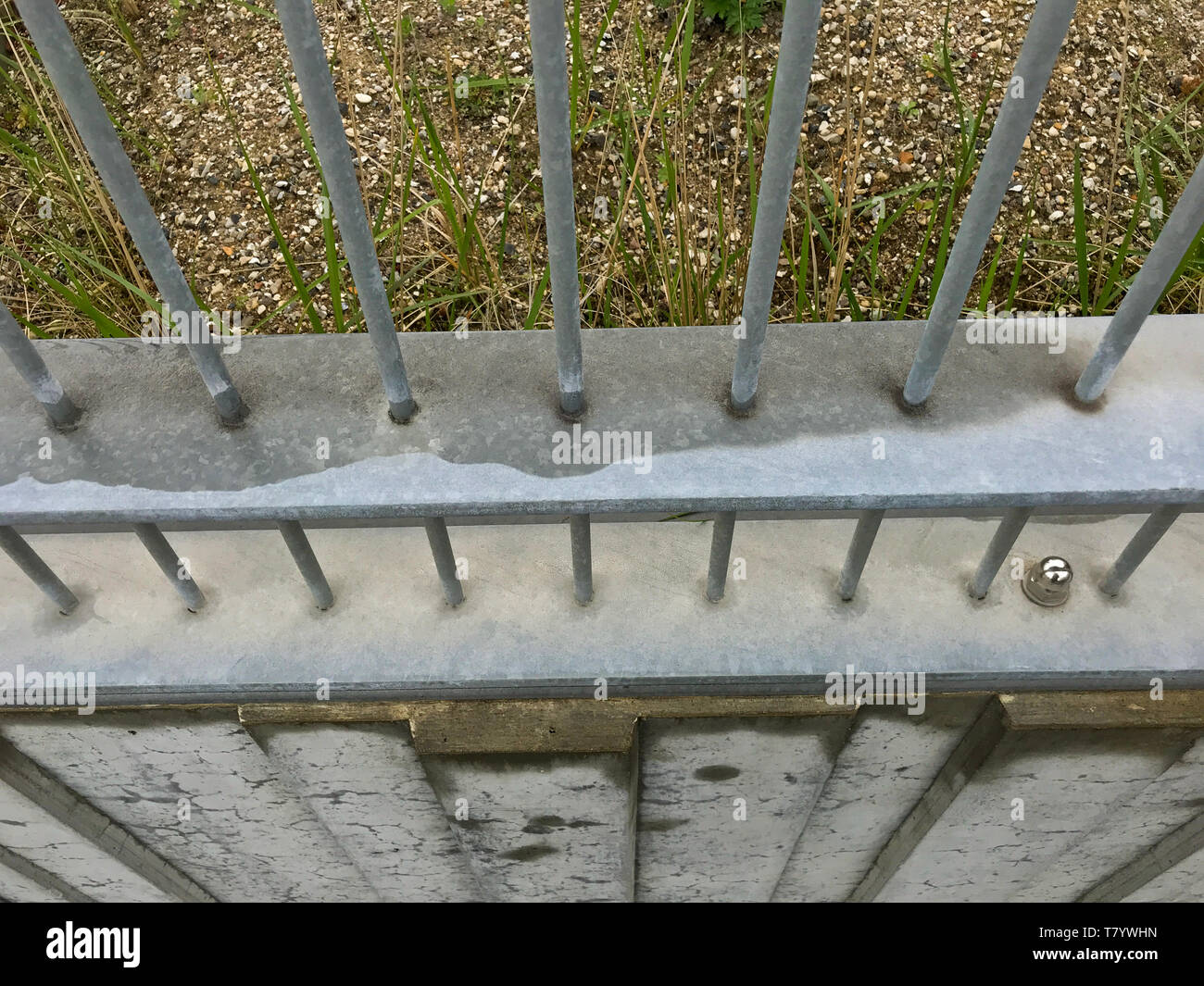 Security fence with iron bars seen from above. border fence or prison ...