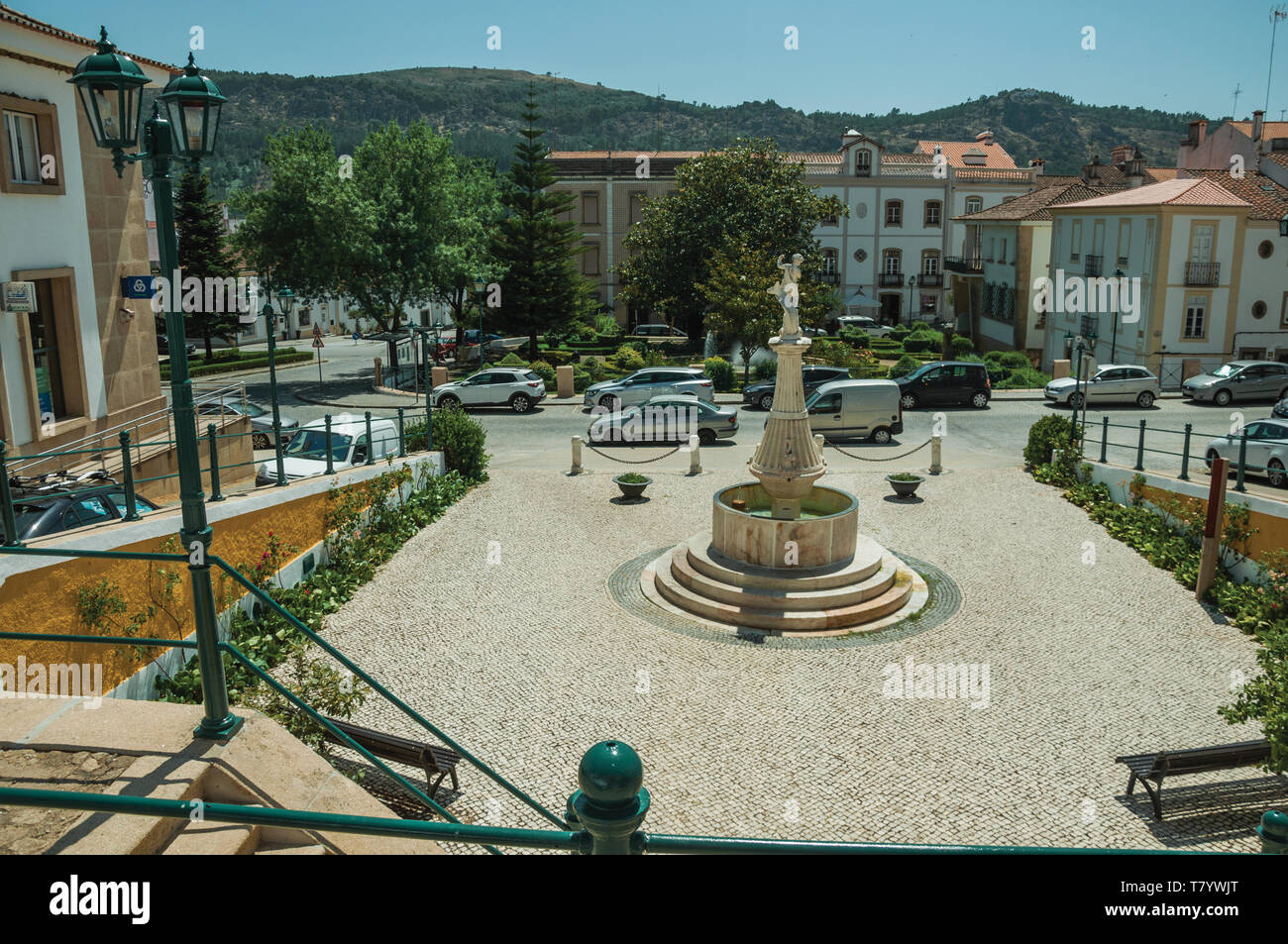 Old colorful houses and green garden around square at Castelo de Vide ...