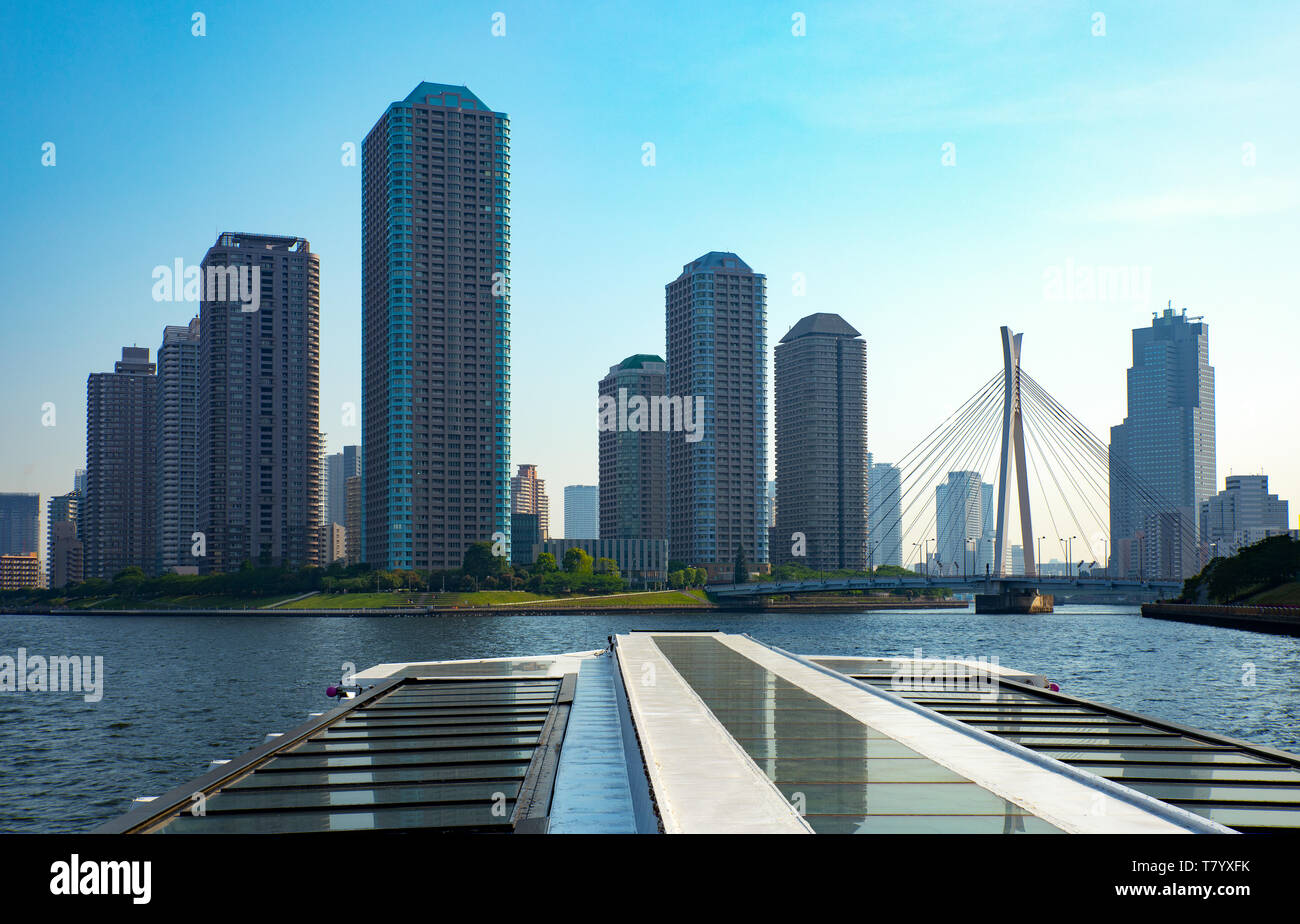 Japan, Tokyo, the skyscrapers of the city seen from a boat sailing on ...