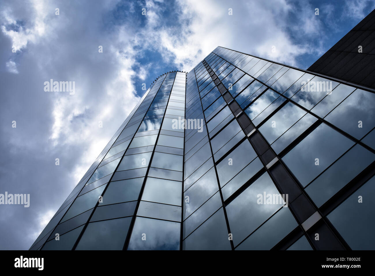 Building seen from below with nice reflection Stock Photo - Alamy