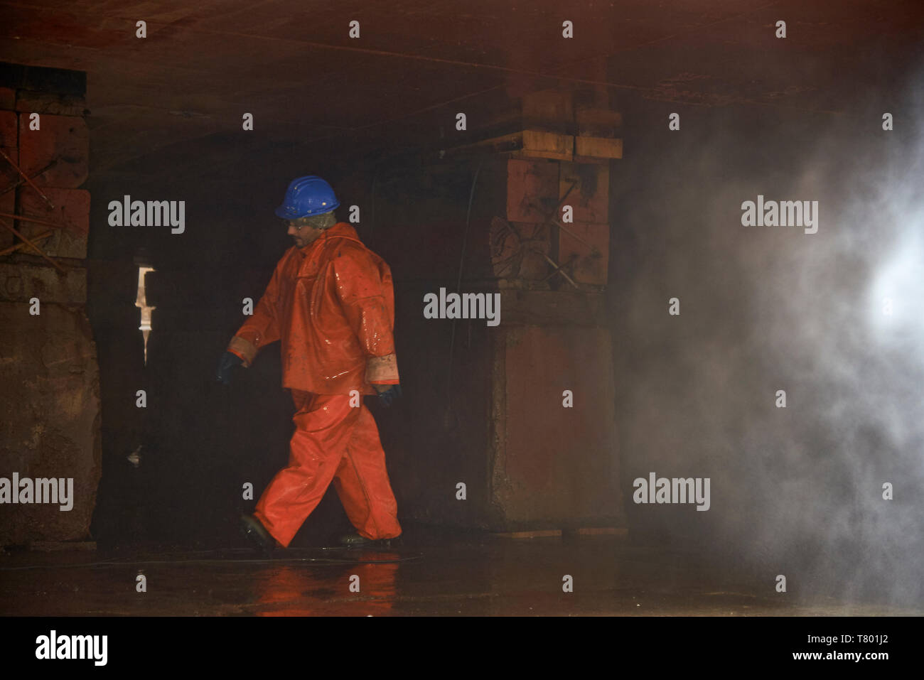 Labour shipping construction workers at the yard working on a new ship ...
