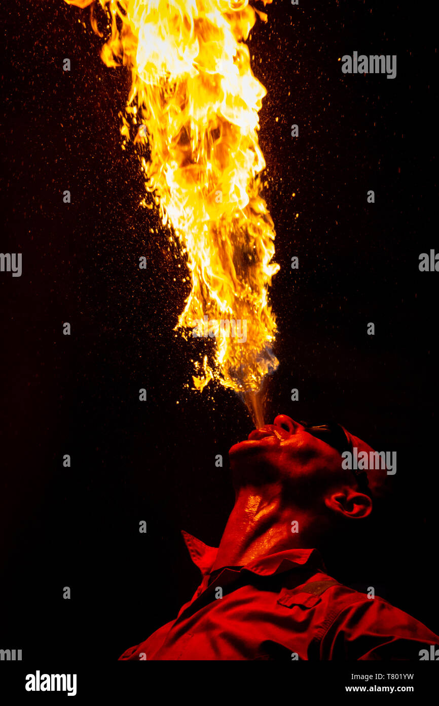 WARSAW, POLAND - July 02, 2018: A fire spitting Artist is performing in ...