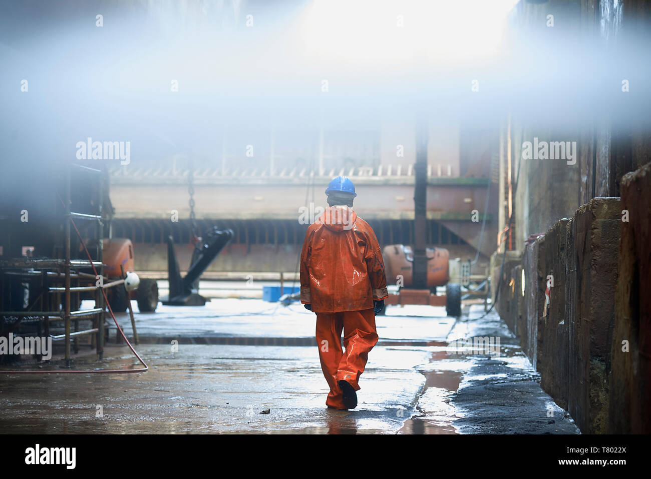 Labour shipping construction workers at the yard working on a new ship ...