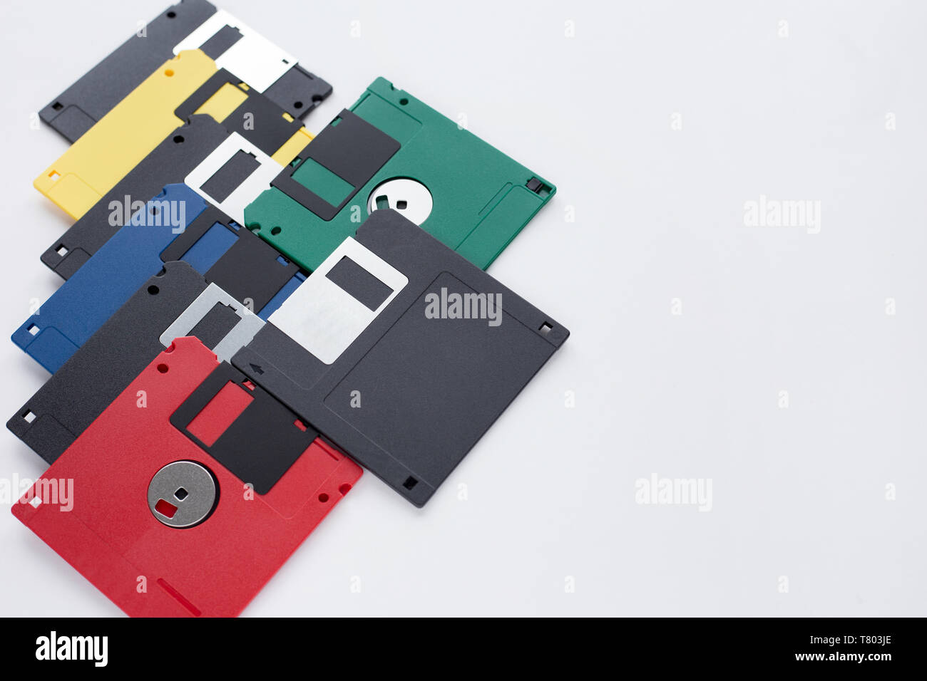 Group of multi-colored flexible disks isolated on a white background ...