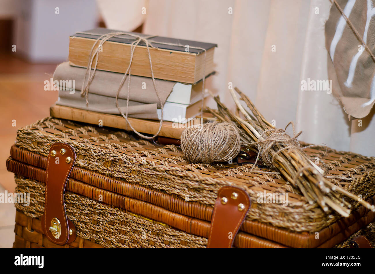 Interesting composition with the picnic basket, pile of books, a ball ...