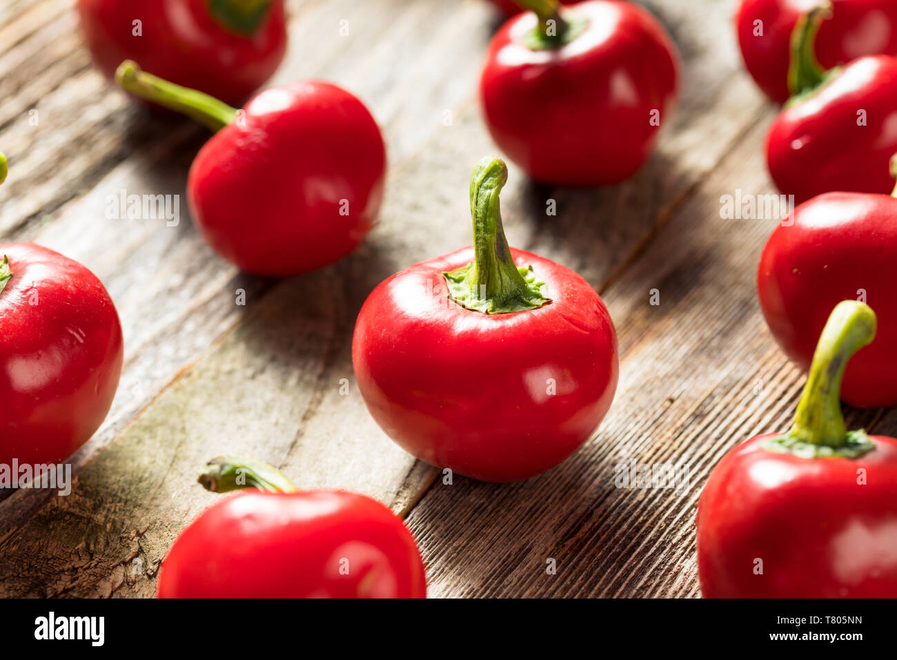 Raw Organic Red Cherry Bomb Peppers Ready to Cook Stock Photo - Alamy