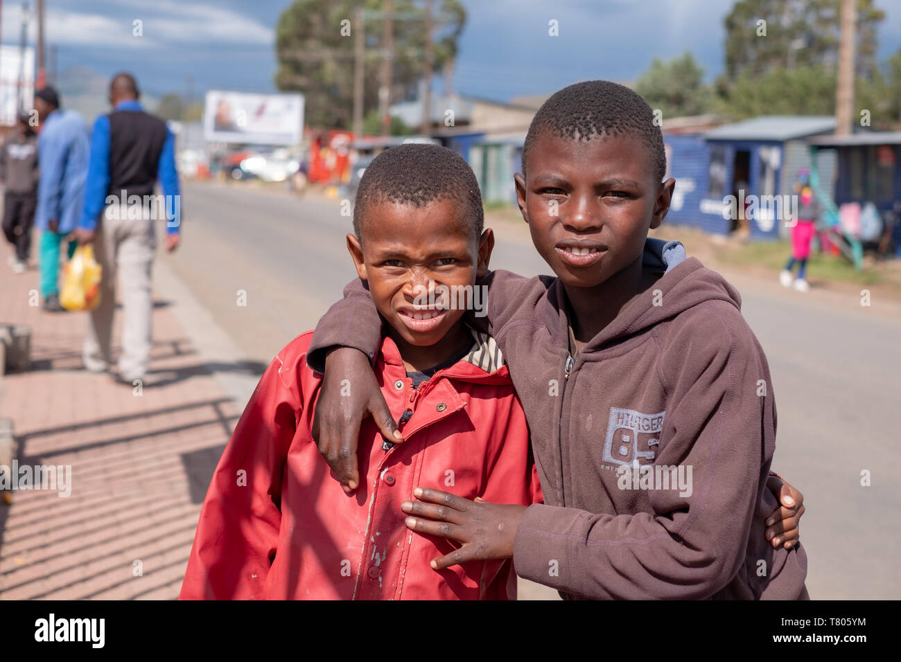 Young children pose for the camera on the main street in the town of ...